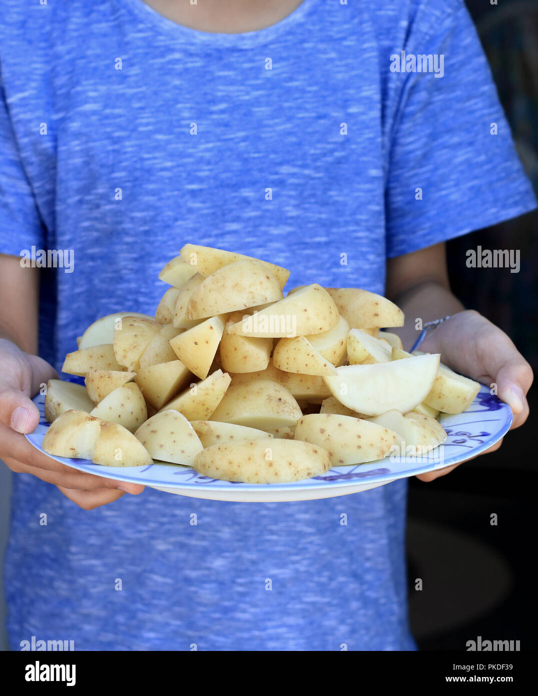 Raw Potatoes Wedges Stock Photo - Alamy