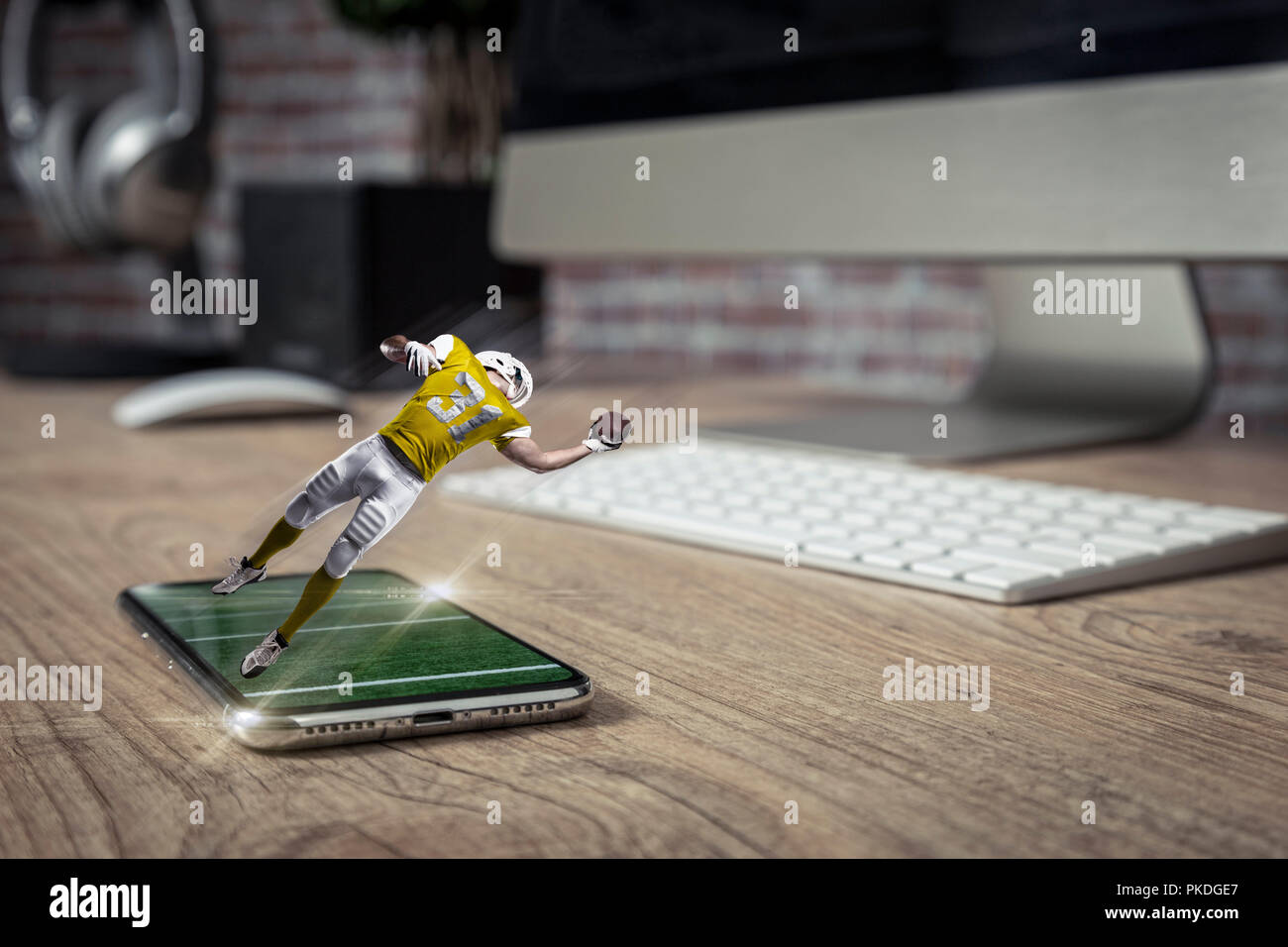 Football Player with a yellow uniform playing and coming out of a full ...