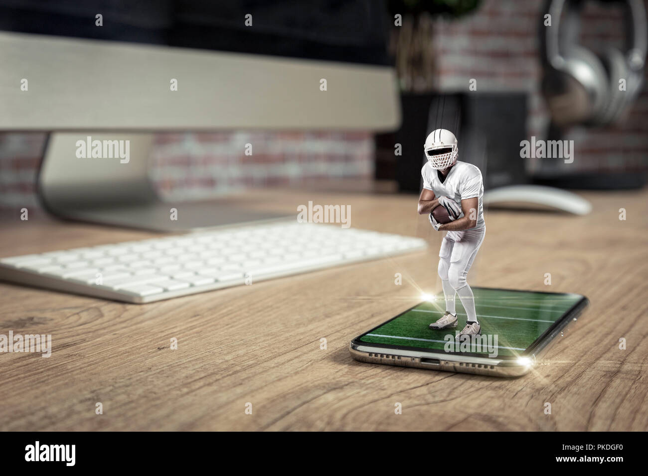 Football Player with a white uniform playing and coming out of a full ...