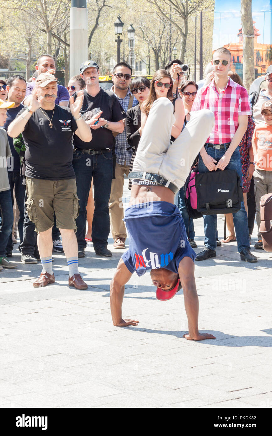PARIS, FRANCE - APRIL 25:B-boy doing some breakdance moves in front a ...