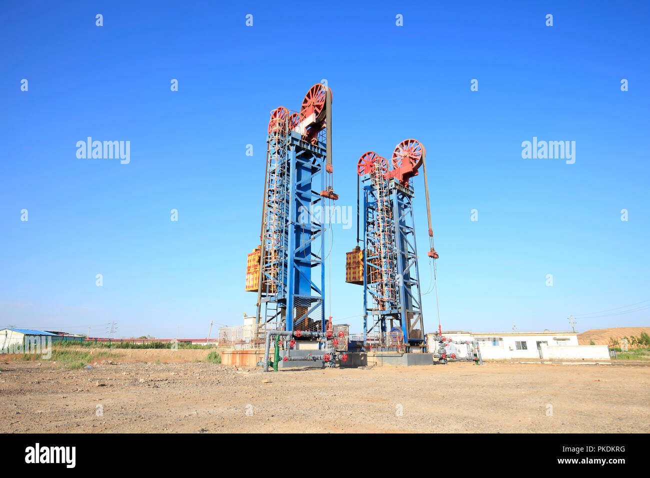Oil field scene,Tower type pumping unit under the blue sky Stock Photo ...