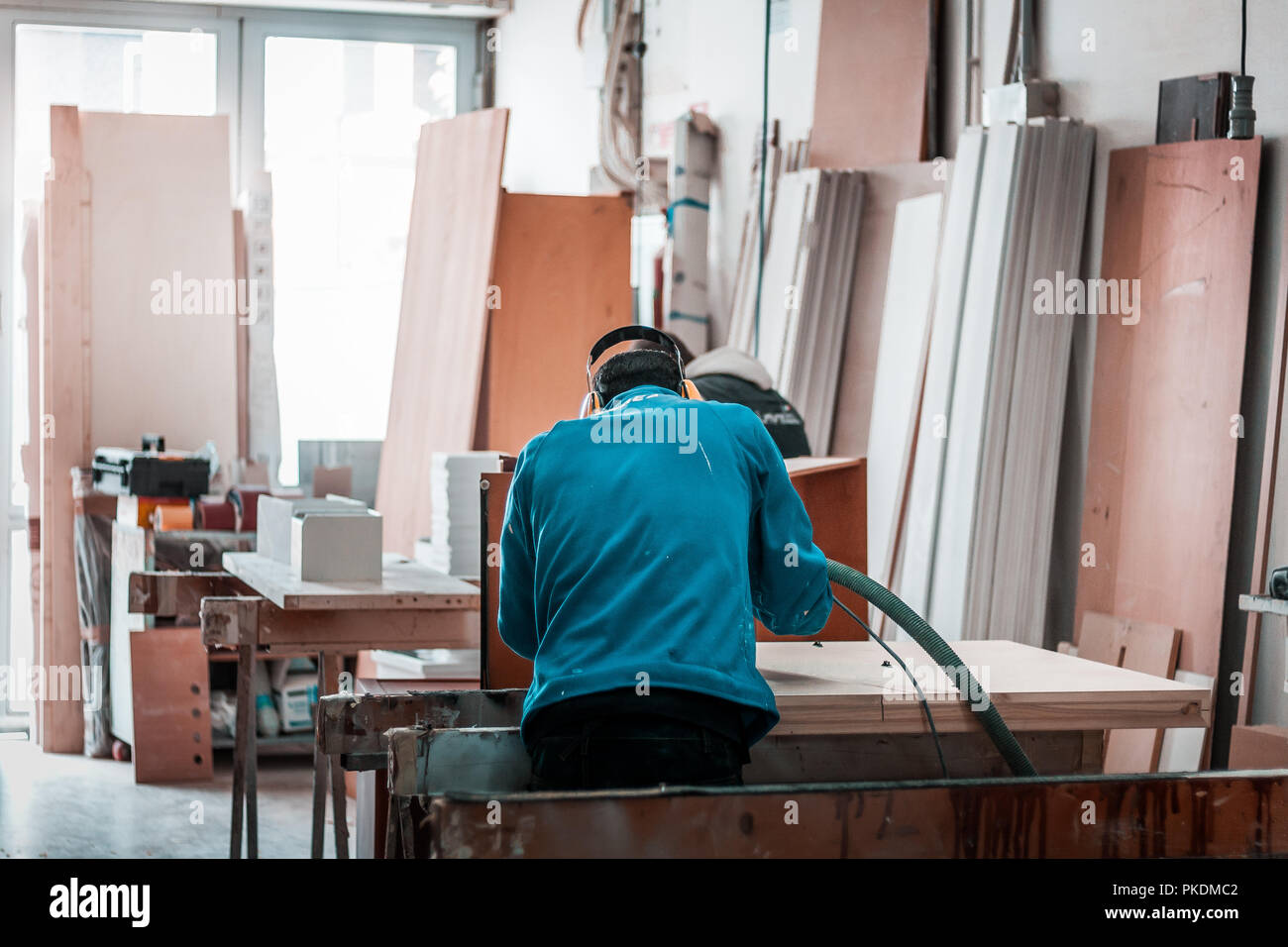 Professional woodshop store in Italy, focus on hands and working tools ...