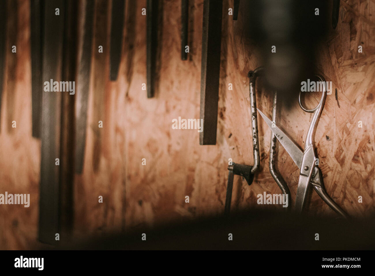 Extreme close up shots of hanging tools inside woodshop. Carpentry life ...