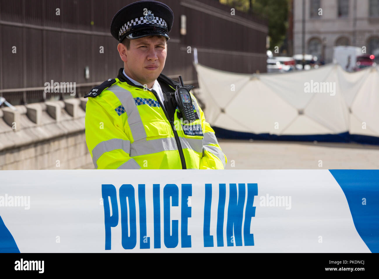 Police barriers, sheild the aftermath of the latest incident where a ...