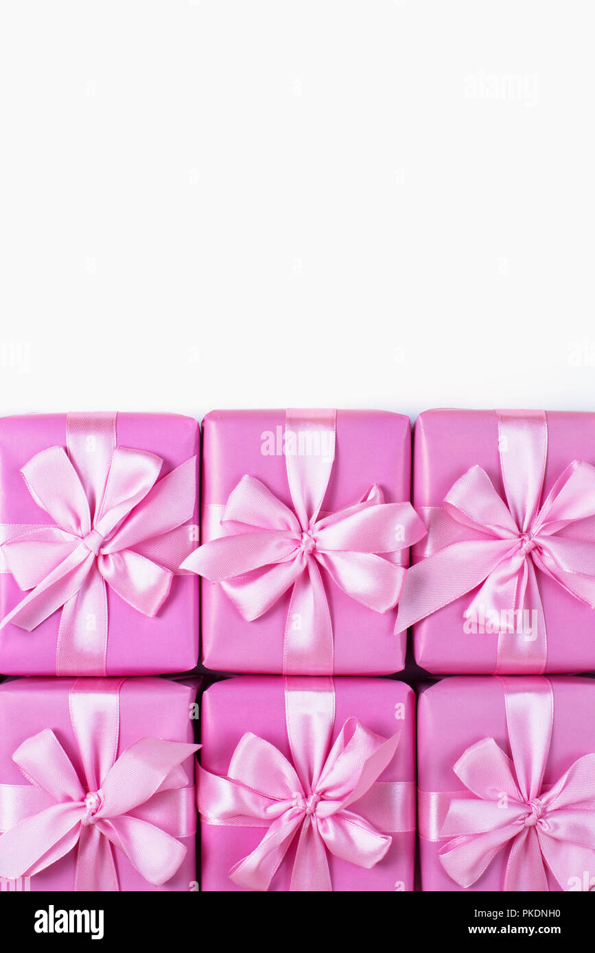 Rows of boxes six with gifts decoration ribbon satin bow pink. A top ...
