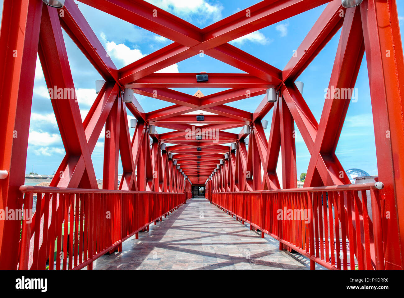 Red iron pedestrian walkway Stock Photo - Alamy