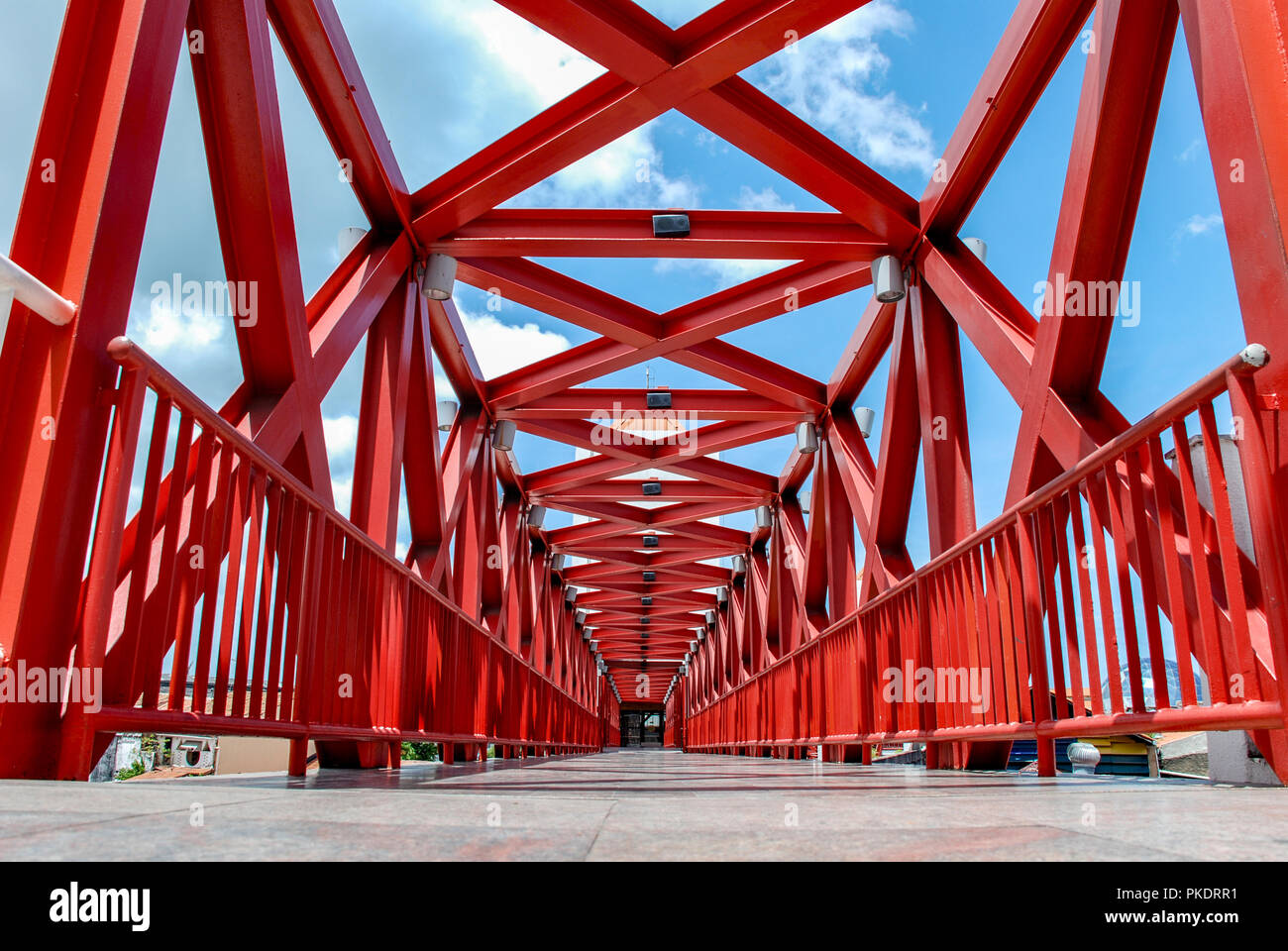 Red iron pedestrian walkway Stock Photo - Alamy