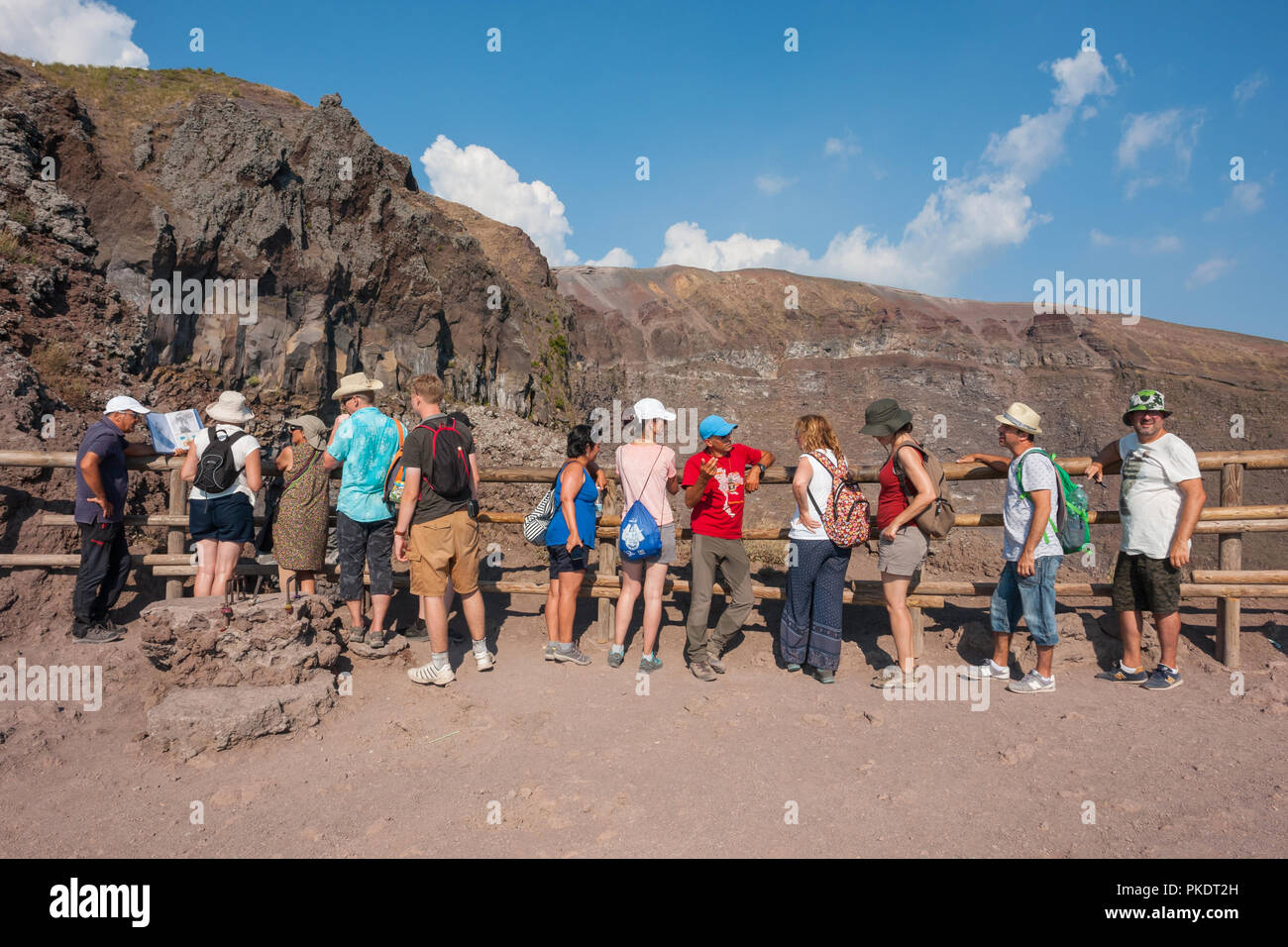MOUNT VESUVIUS, ITALY - AUGUST 1, 2018: Tourists walk around the crater ...