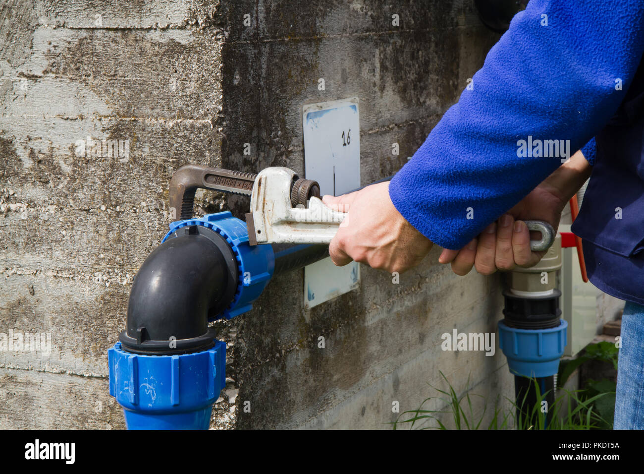plumber at work in wastewater treatment plant Stock Photo - Alamy