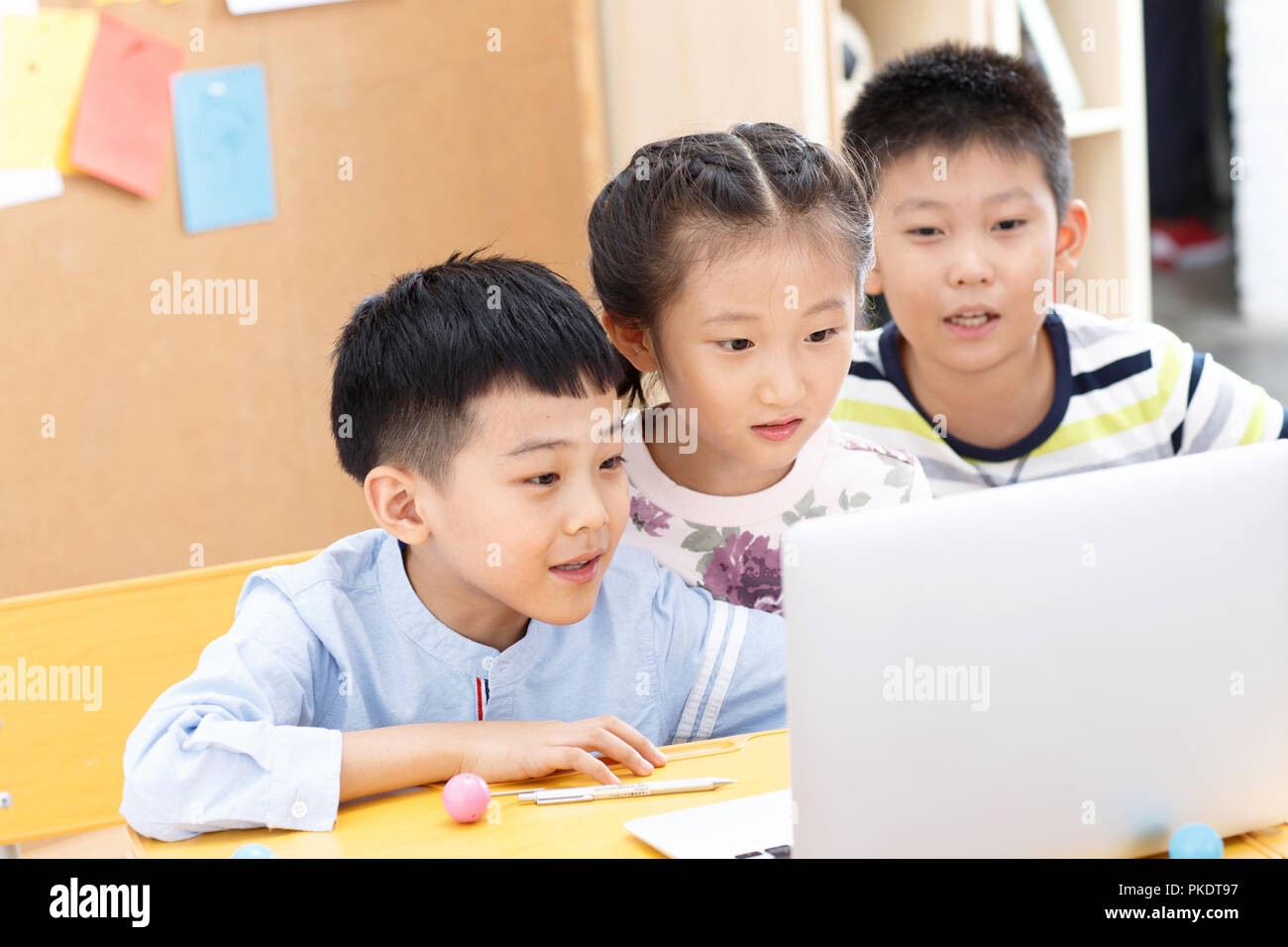 Elementary school students use computers in the classroom Stock Photo ...