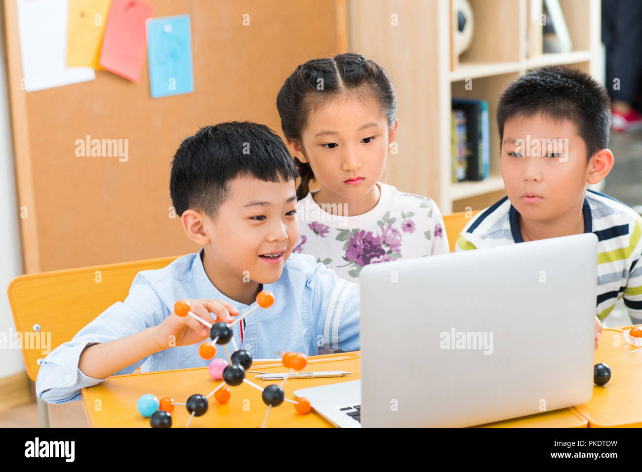 Elementary school students use computers in the classroom Stock Photo ...