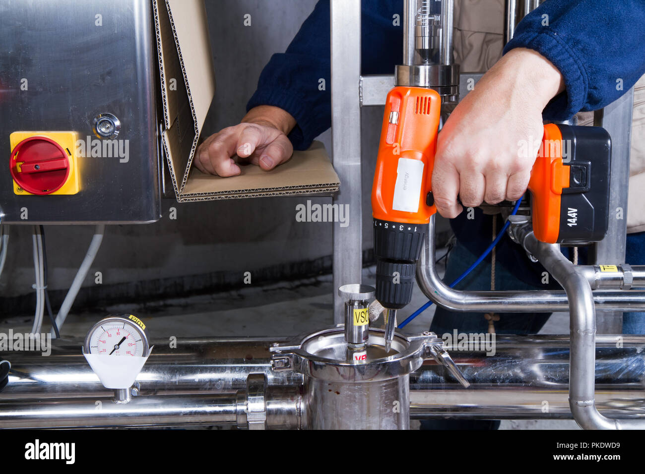 repairman at maintenance work Stock Photo - Alamy