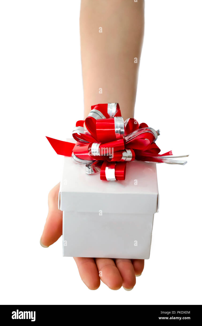 Front view of a woman's hand and a gift with a red ribbon. Isolated on ...
