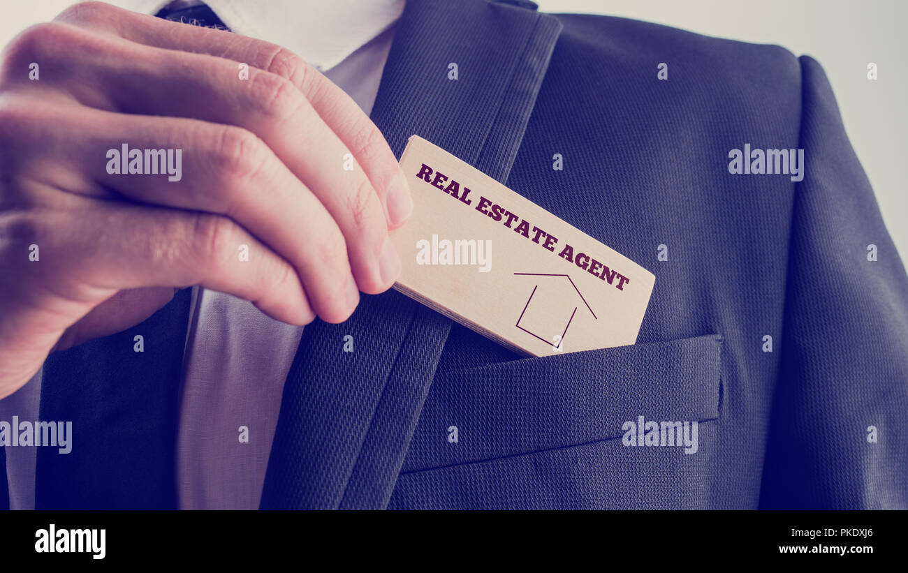Real Estate Agent in Black Suit Putting Small Wooden Piece with Real ...