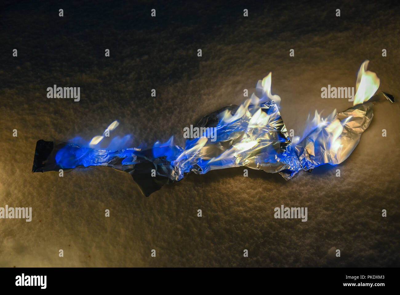 Burning aluminium sheet on the Snow Stock Photo - Alamy