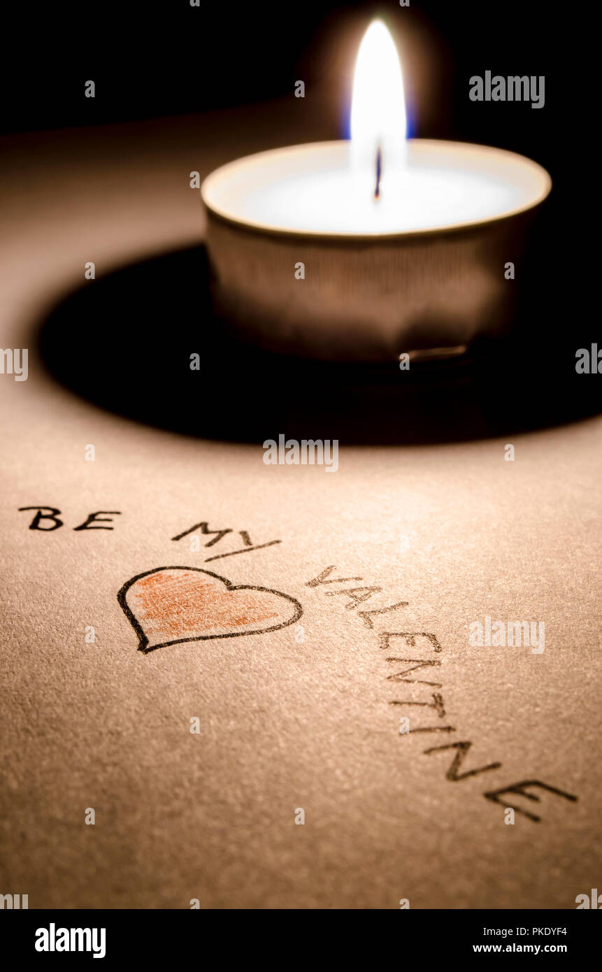 Be my Valentine message and a heart by the candle light Stock Photo - Alamy