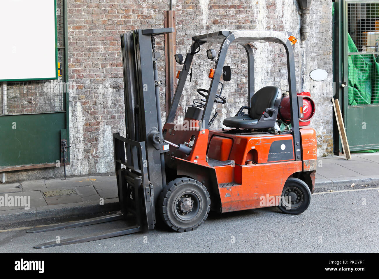Gas powered small forklift in industrial warehouse Stock Photo - Alamy