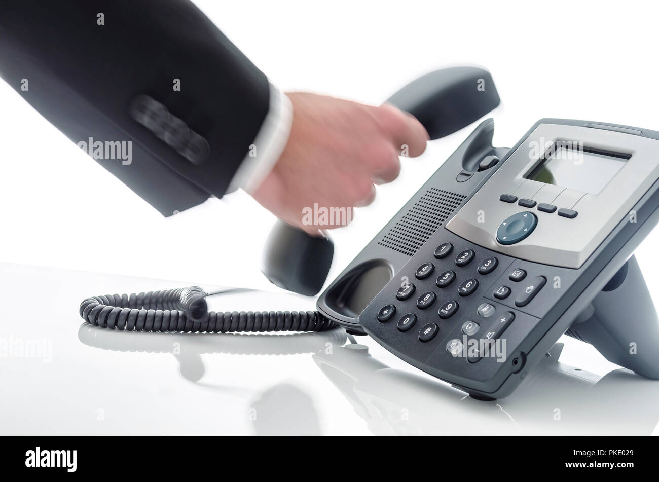 Closeup of a blurred male hand using a phone Stock Photo - Alamy