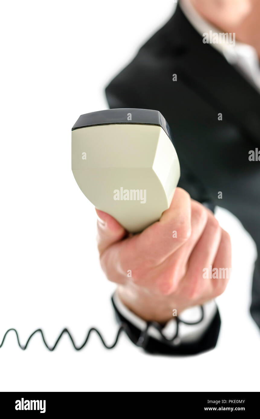Close up of business man holding telephone receiver. Isolated over ...