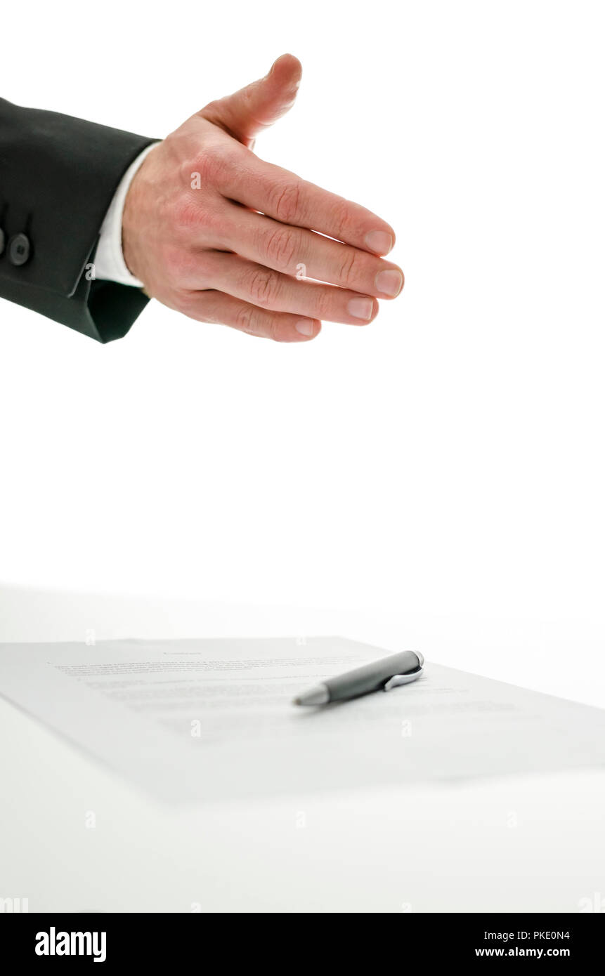 Business man offering a handshake over a signed contract. Isolated over ...