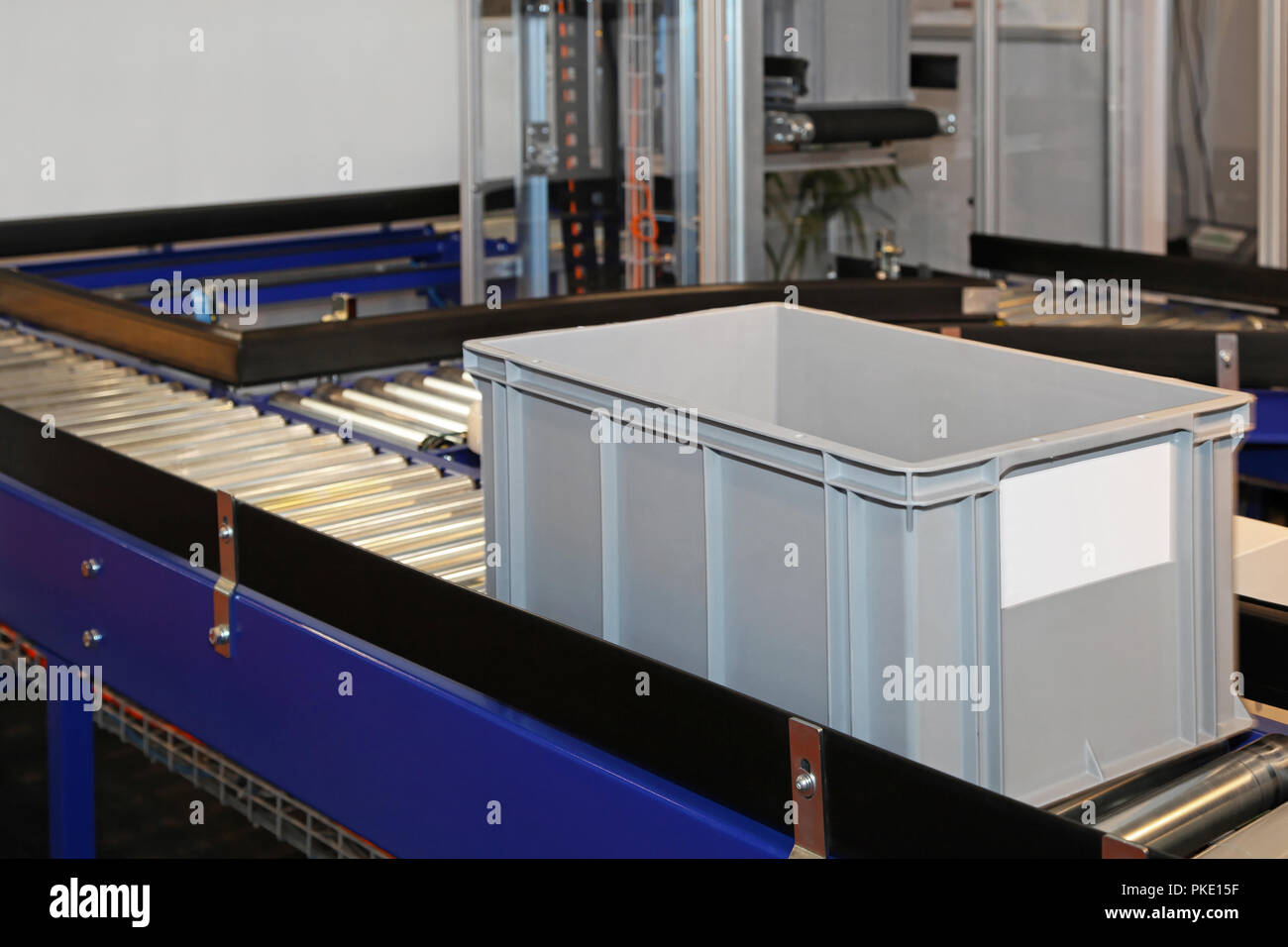 Conveyor rollers line transport system in factory Stock Photo - Alamy