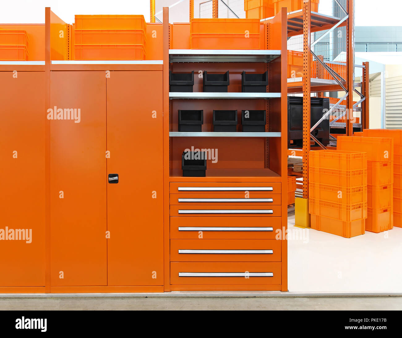 Orange shelving system for storage in warehouse Stock Photo - Alamy