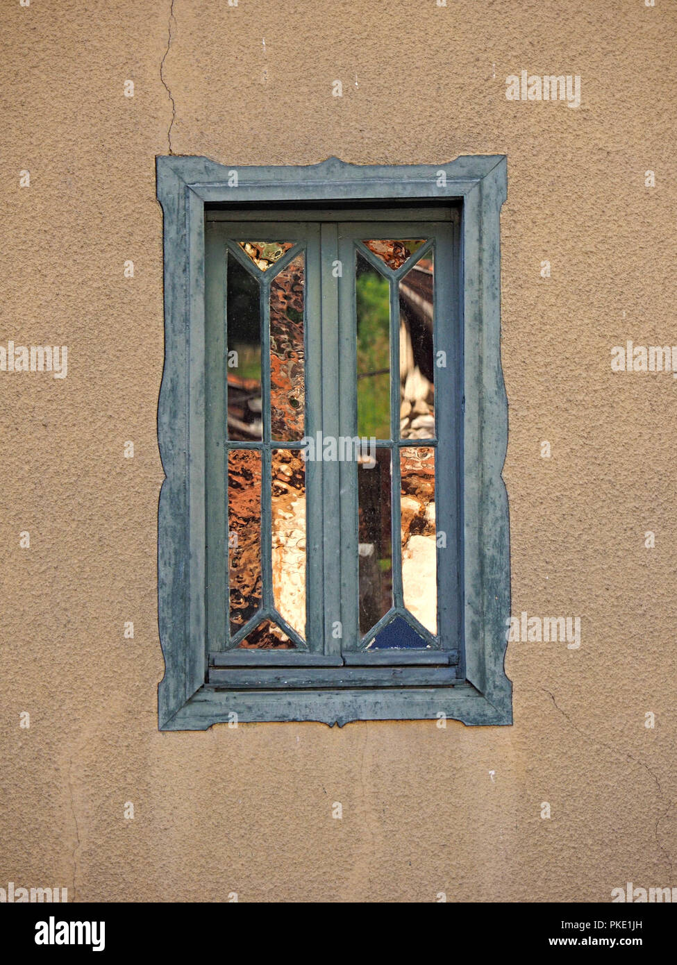 distorted reflections of sunlit buildings opposite shining in blue ...