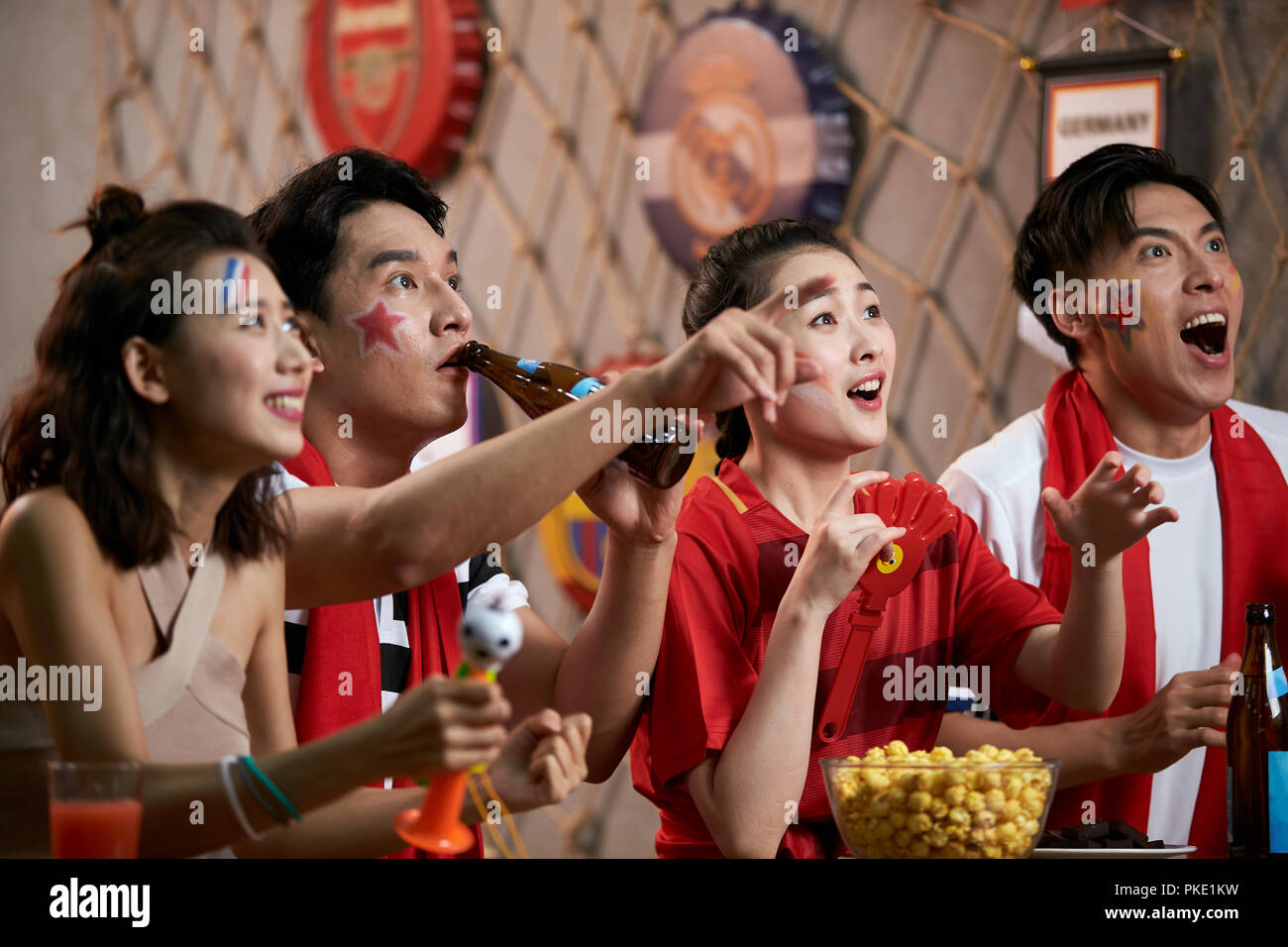 The fans watching the game Stock Photo - Alamy