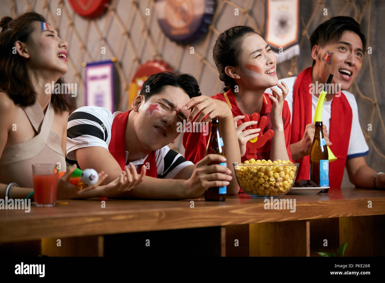 The fans watching the game Stock Photo - Alamy
