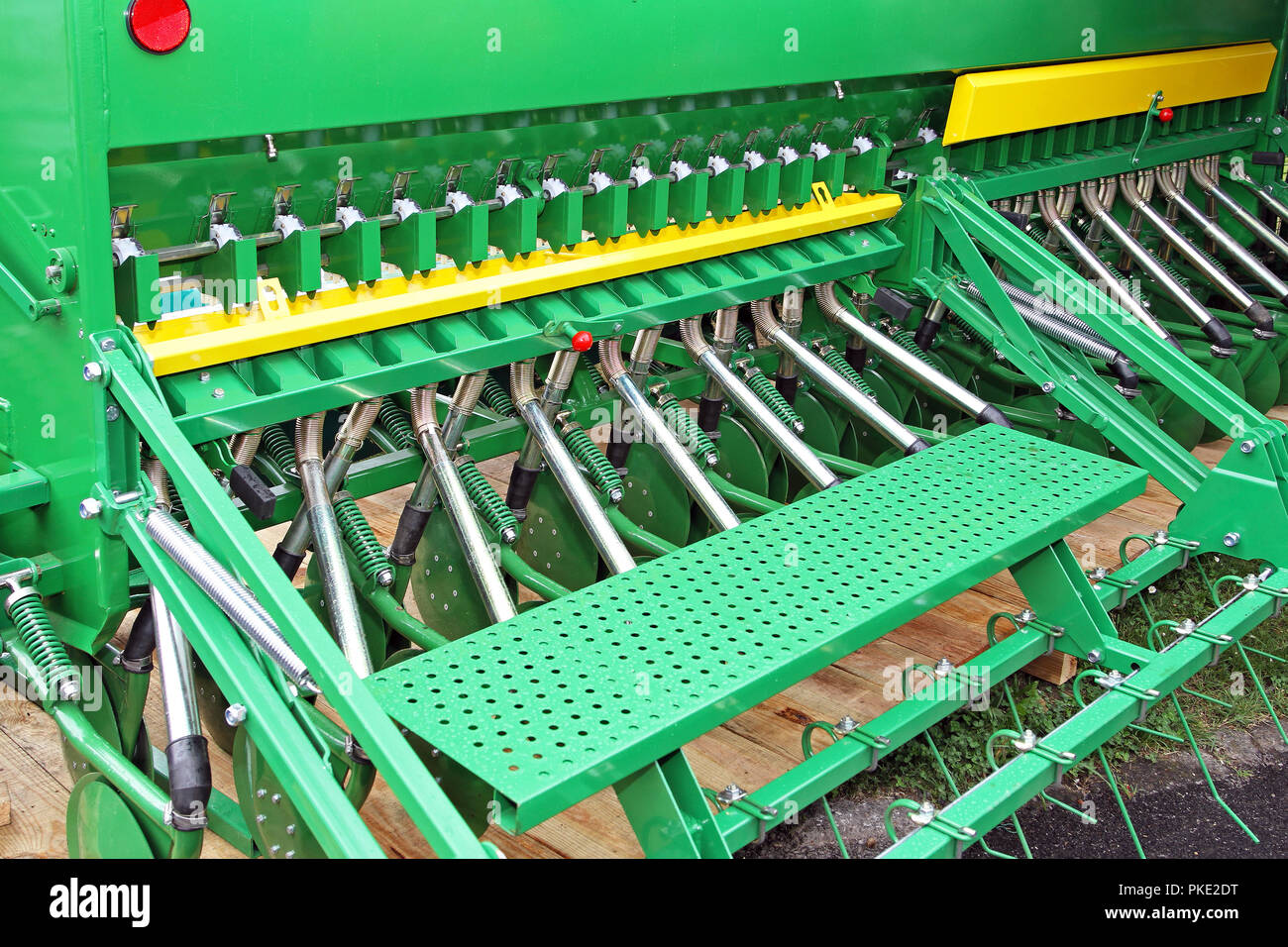 Green seeder planter row machine for agriculture Stock Photo - Alamy