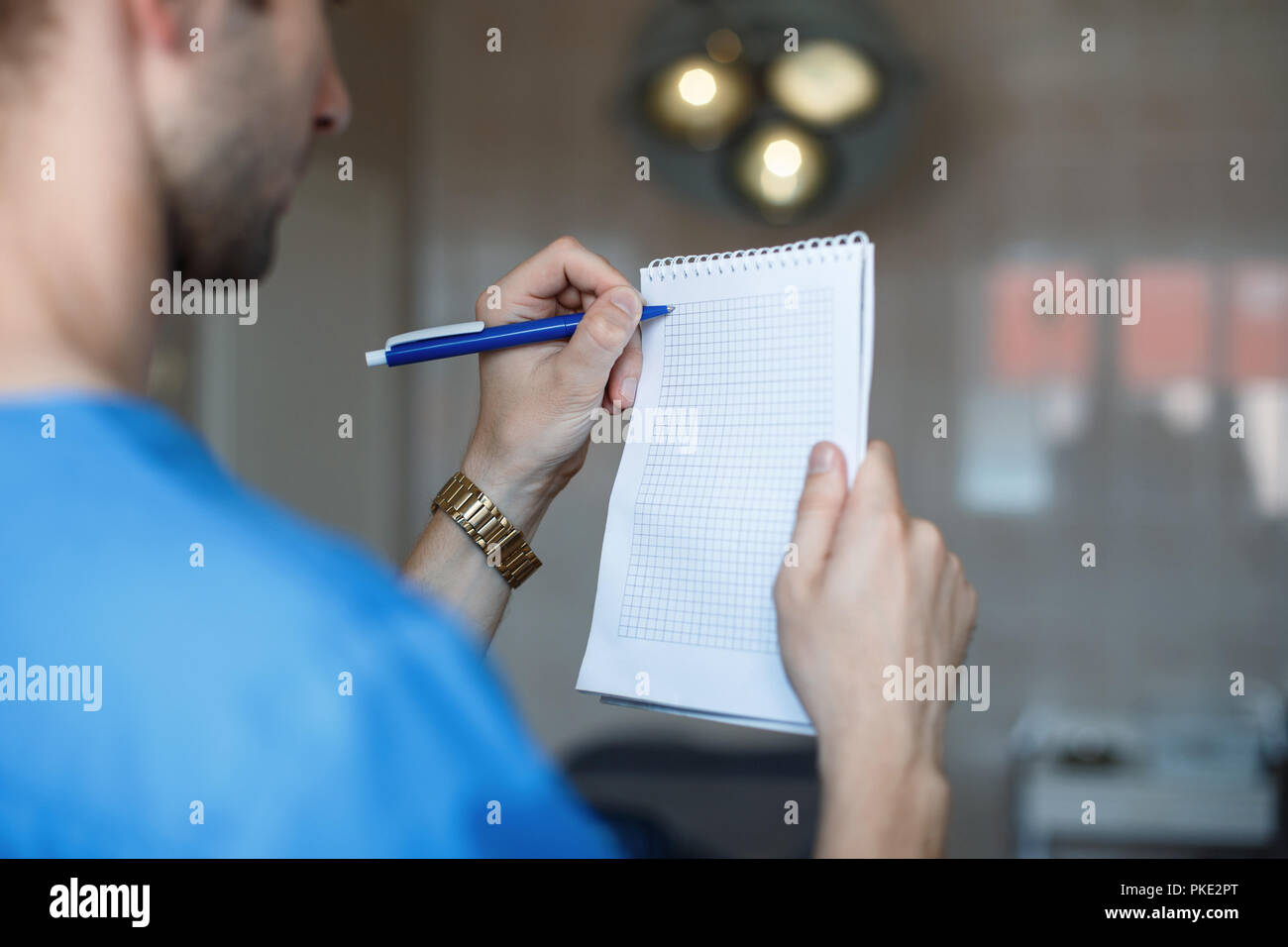 Doctor surgeon writing in hi-res stock photography and images - Alamy