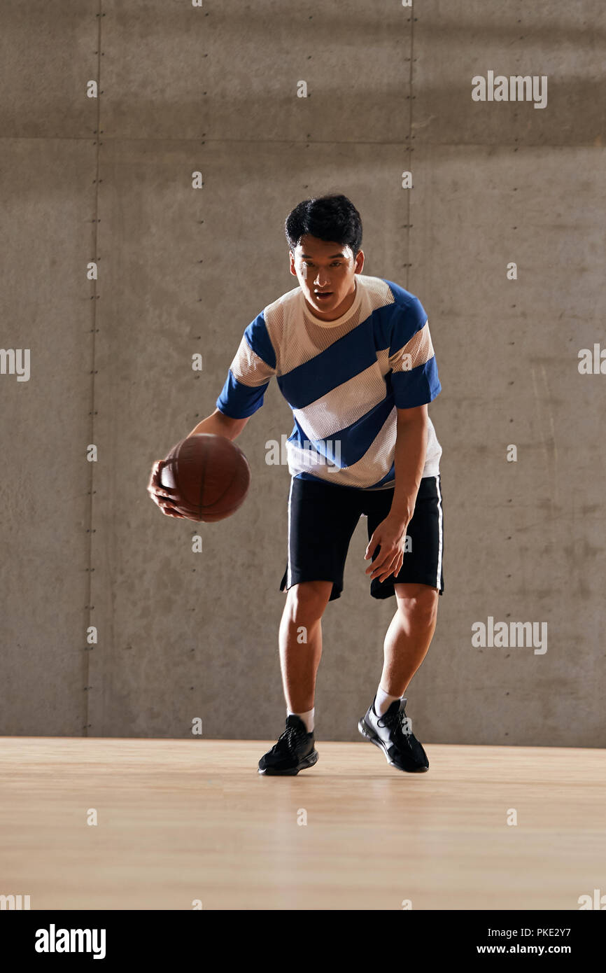 Indian man playing basketball hi-res stock photography and images - Alamy