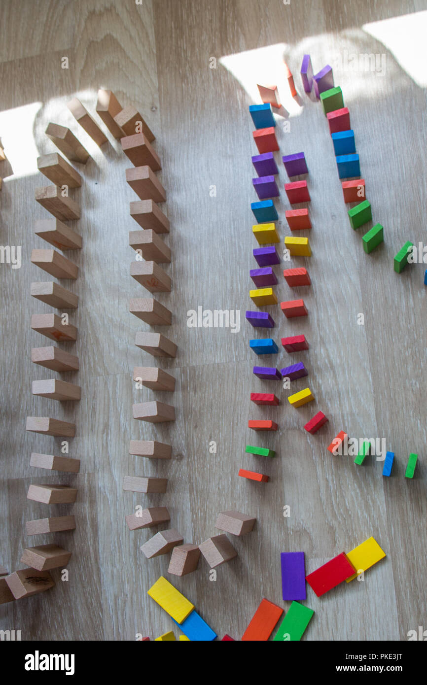 Colorful Domino Blocks in a line on a white background Stock Photo - Alamy