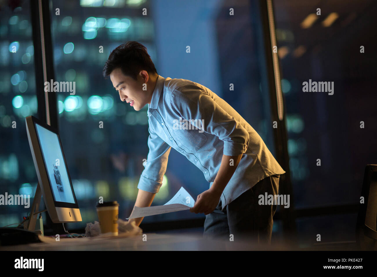 Business men in the office to work overtime Stock Photo - Alamy