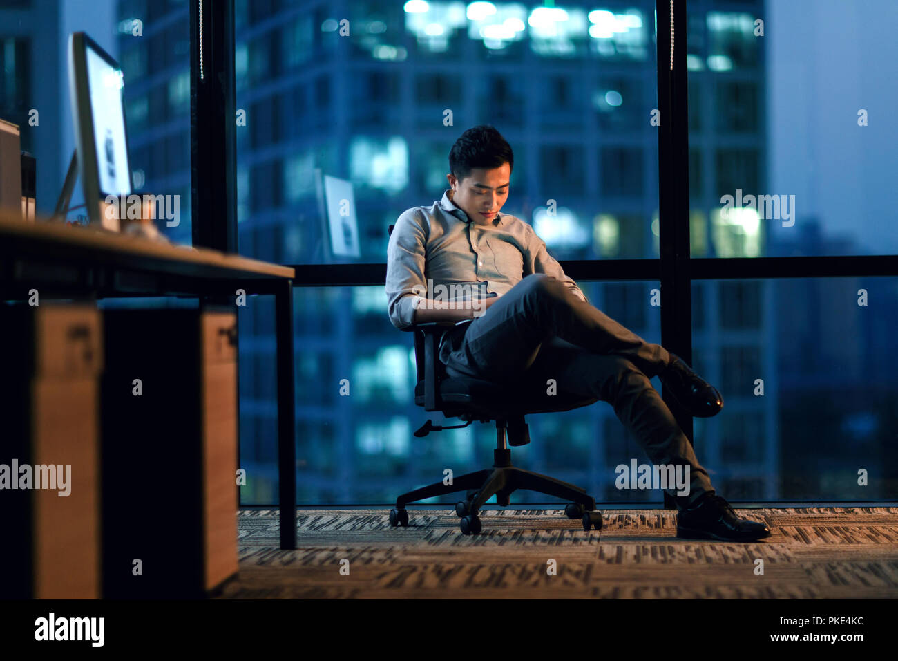 Business men in the office to work overtime Stock Photo - Alamy