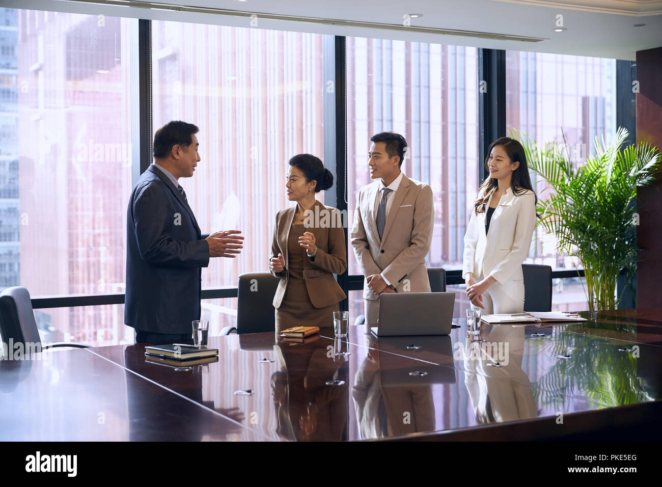 Business men and women in the conference room Stock Photo - Alamy