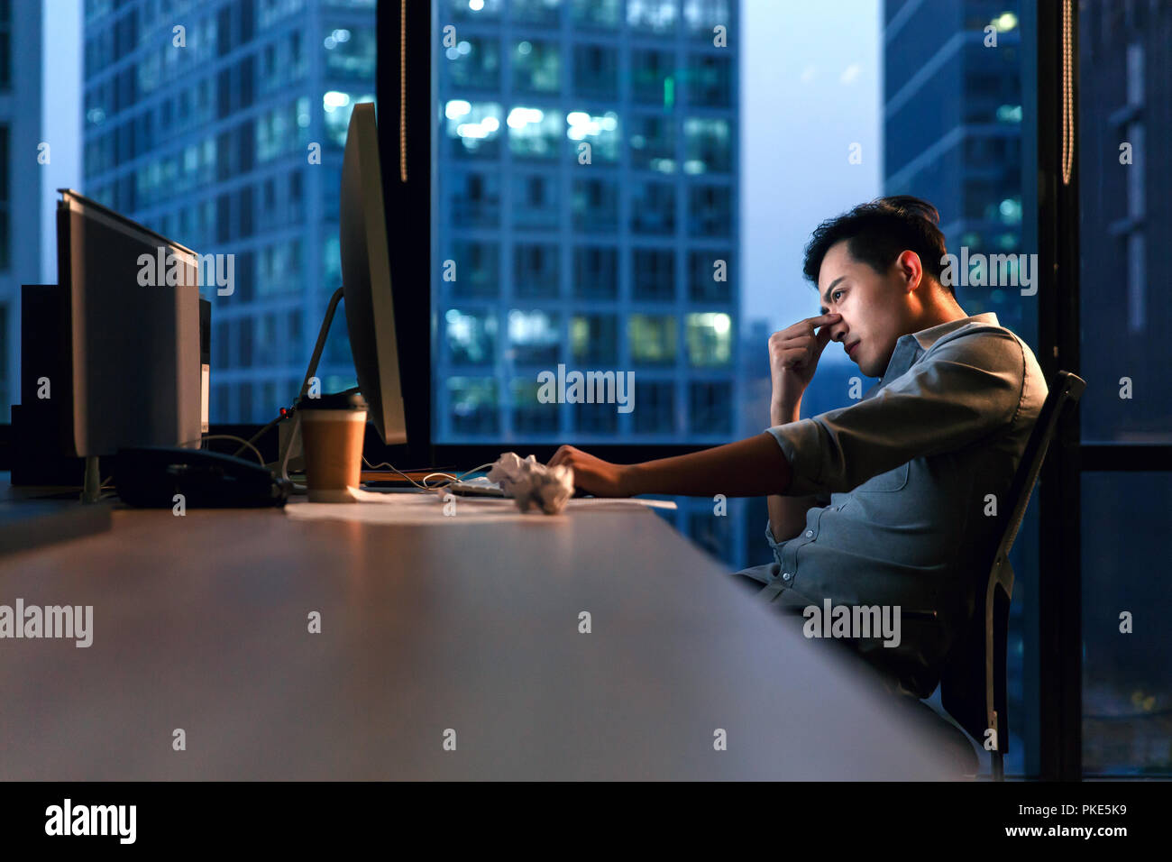 Business men in the office to work overtime Stock Photo - Alamy