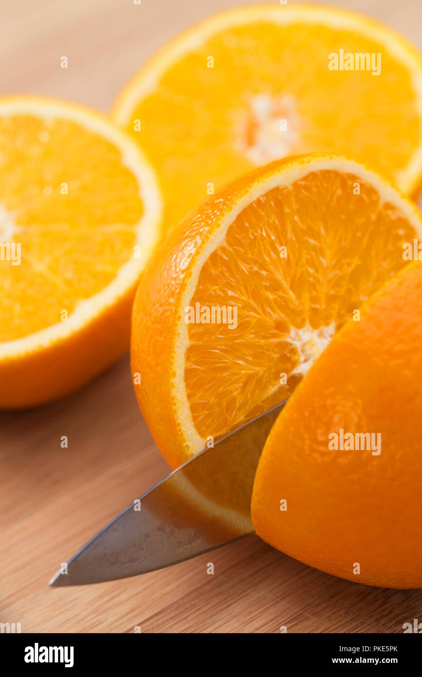 Cut the orange Stock Photo - Alamy