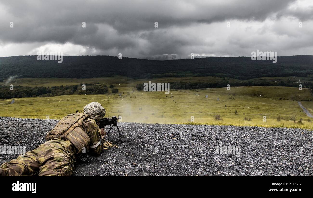 Sgt. Quentin Davis with the New York National Guard fires a M-240 Bravo ...