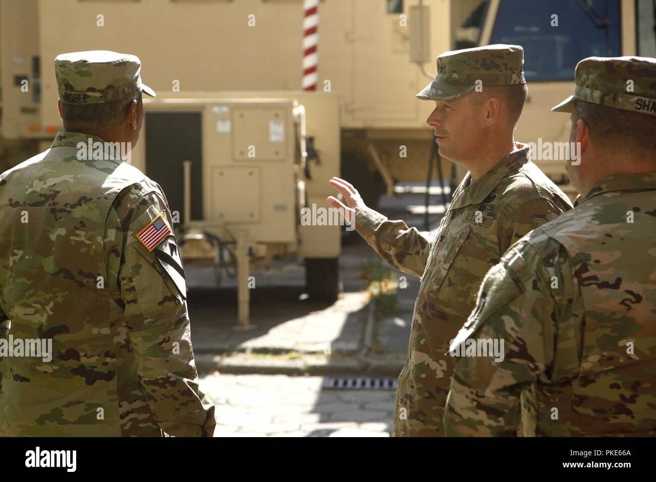 Col. Todd R. Wasmund, center, 1st Infantry Division Mission Command Element commander, discusses ...