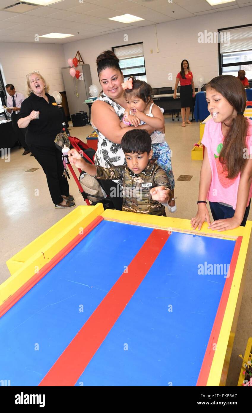 Daniel Castanon, 5, takes turn throwing skeetball with his sister Mia ...