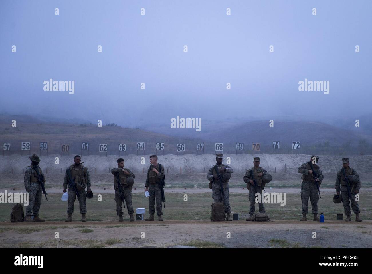 U.S. Marines with Marine Corps Installations West wait to get their ...