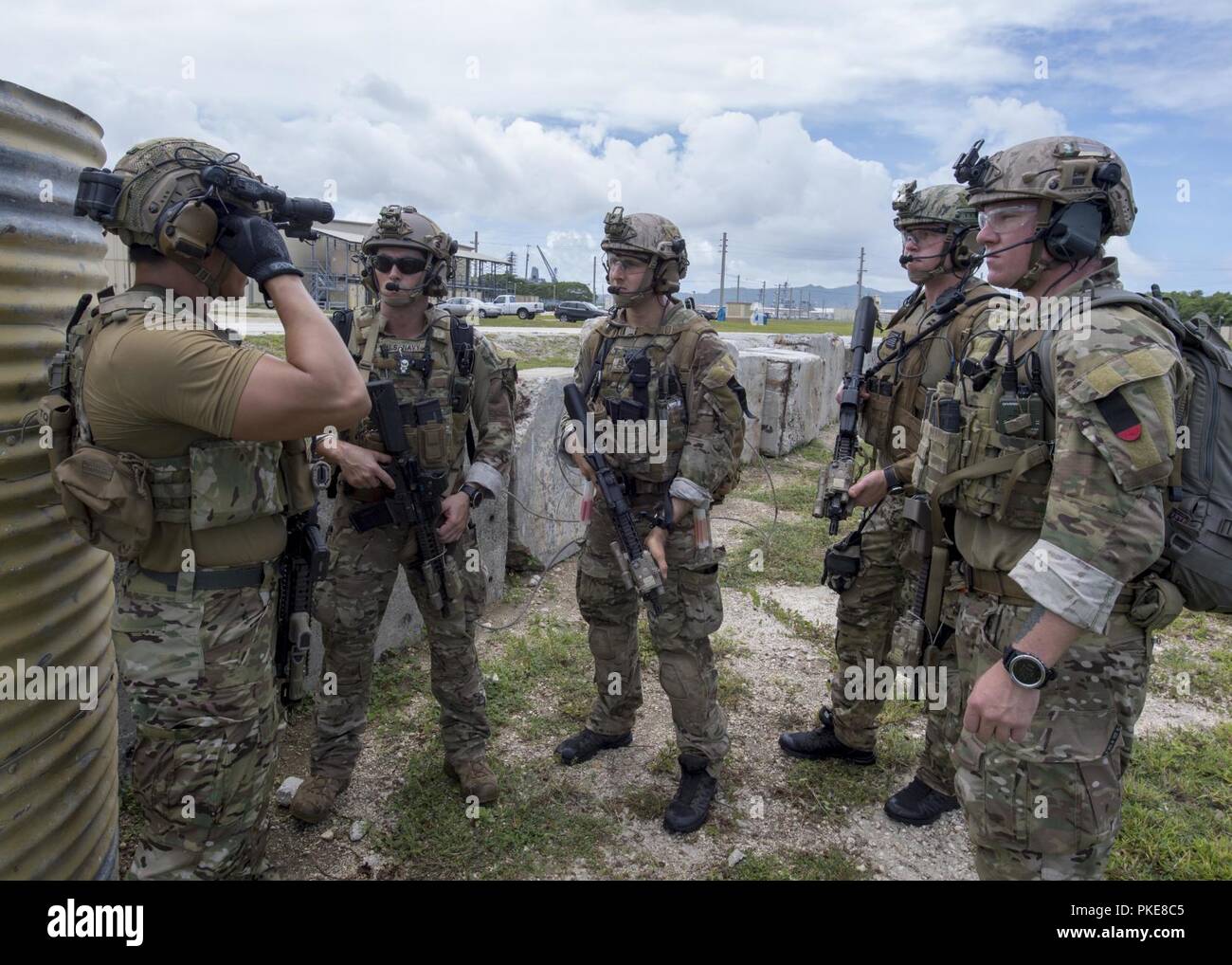 Sailors attached to Explosive Ordnance Disposal Mobile Unit (EODMU) 5 ...
