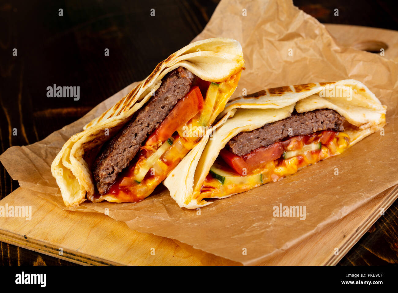 Tasty buritto with meat and vegetables Stock Photo - Alamy
