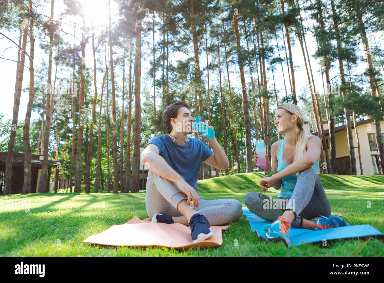 Positive handsome man taking a sip of water Stock Photo - Alamy