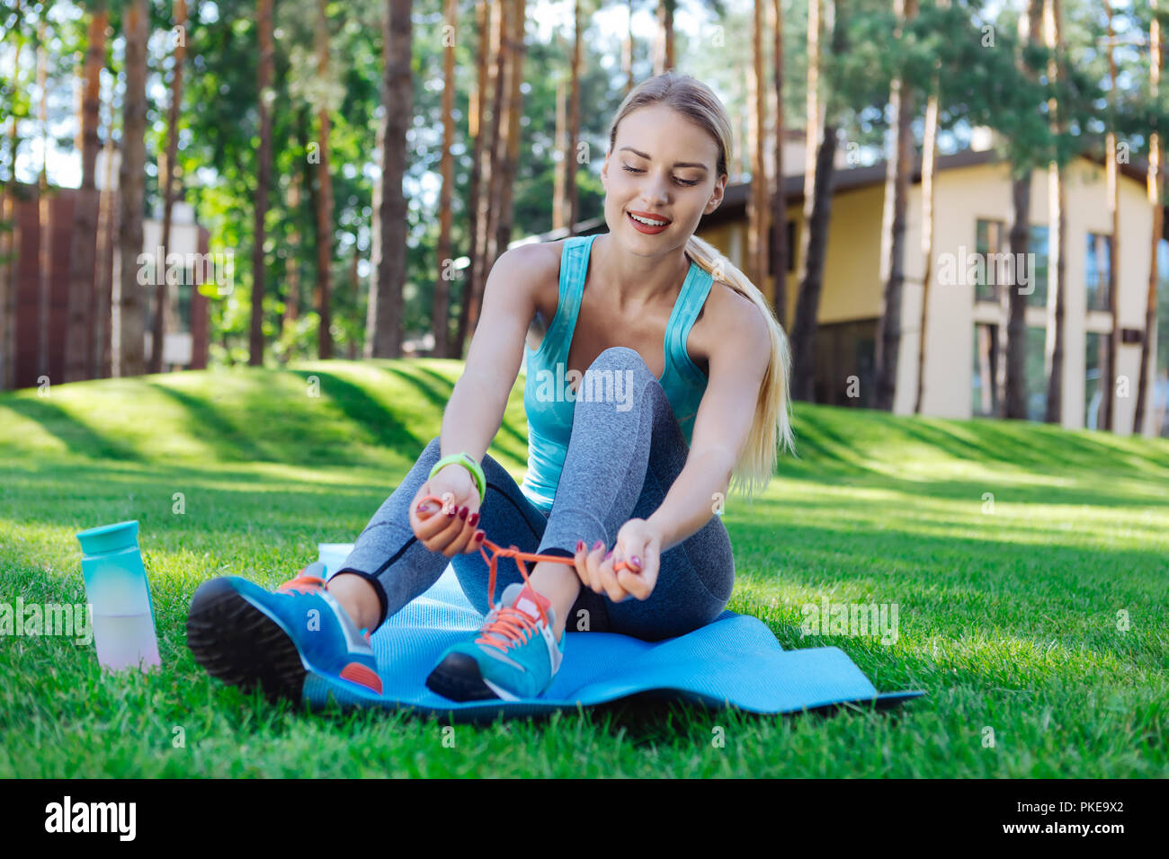Nice young woman getting ready for the workout Stock Photo - Alamy