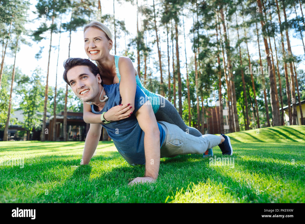 Happy attractive young woman hugging her boyfriend Stock Photo - Alamy