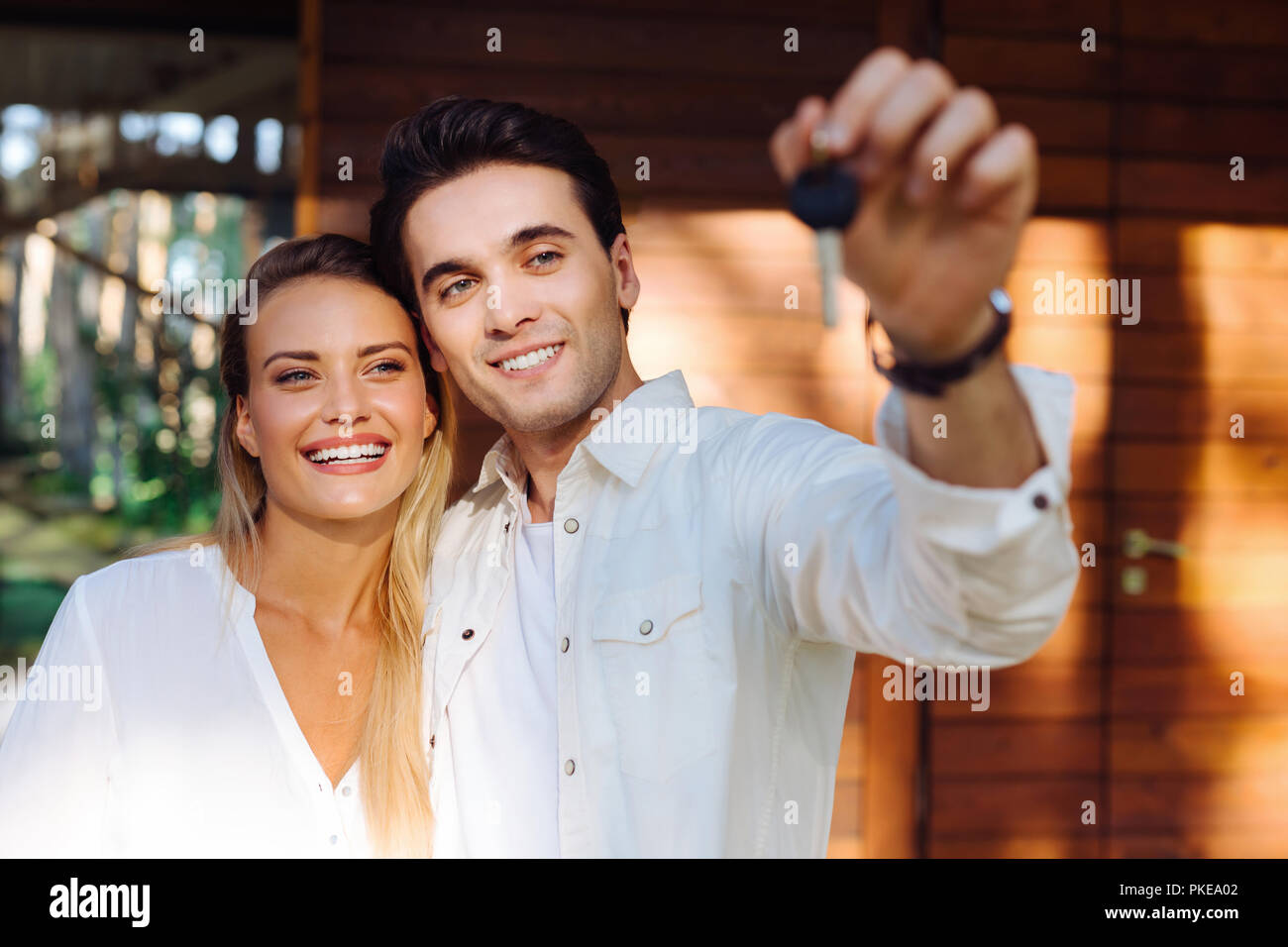 Joyful couple standing together hi-res stock photography and images - Alamy