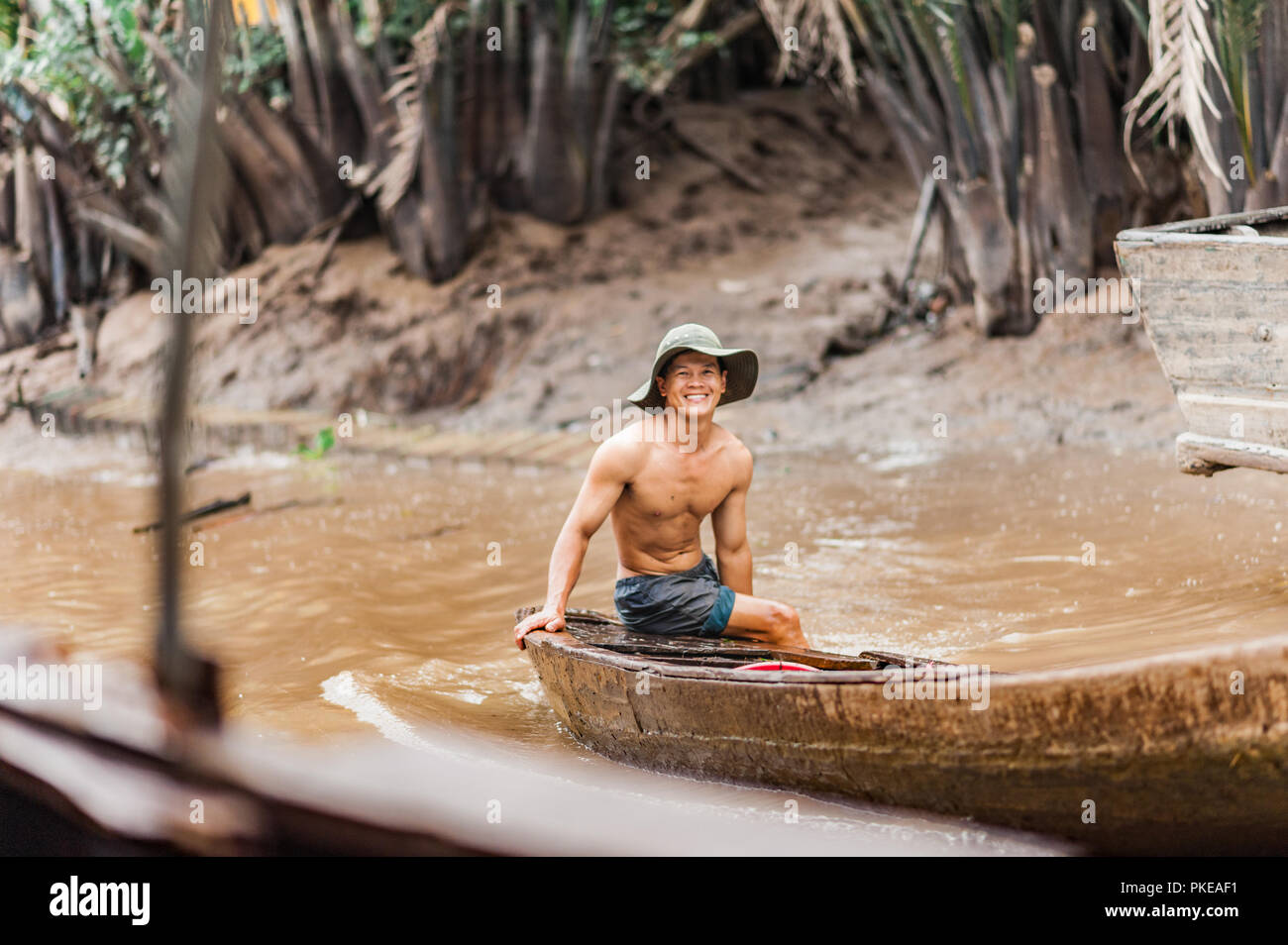 Vietnam man boat mangrove hi-res stock photography and images - Alamy