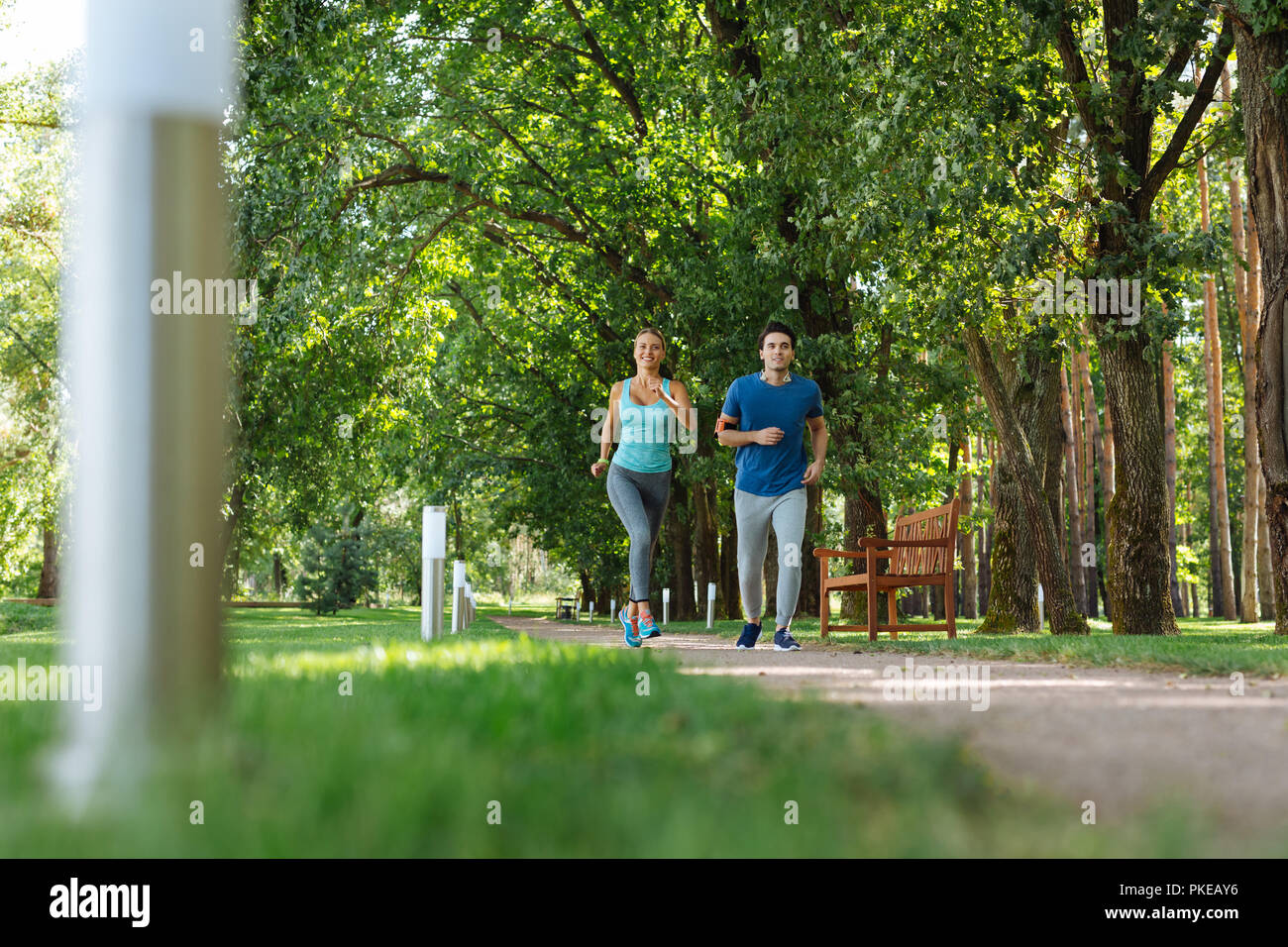 Sporty active friends having a running competition Stock Photo - Alamy
